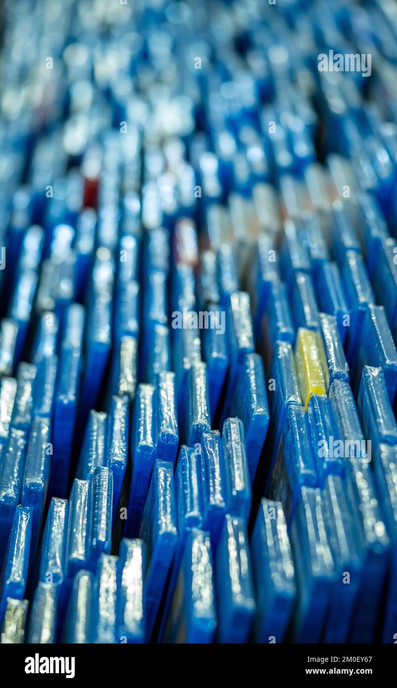 Detail of movies and dvds on a shelf in a movie collectors shop and ...