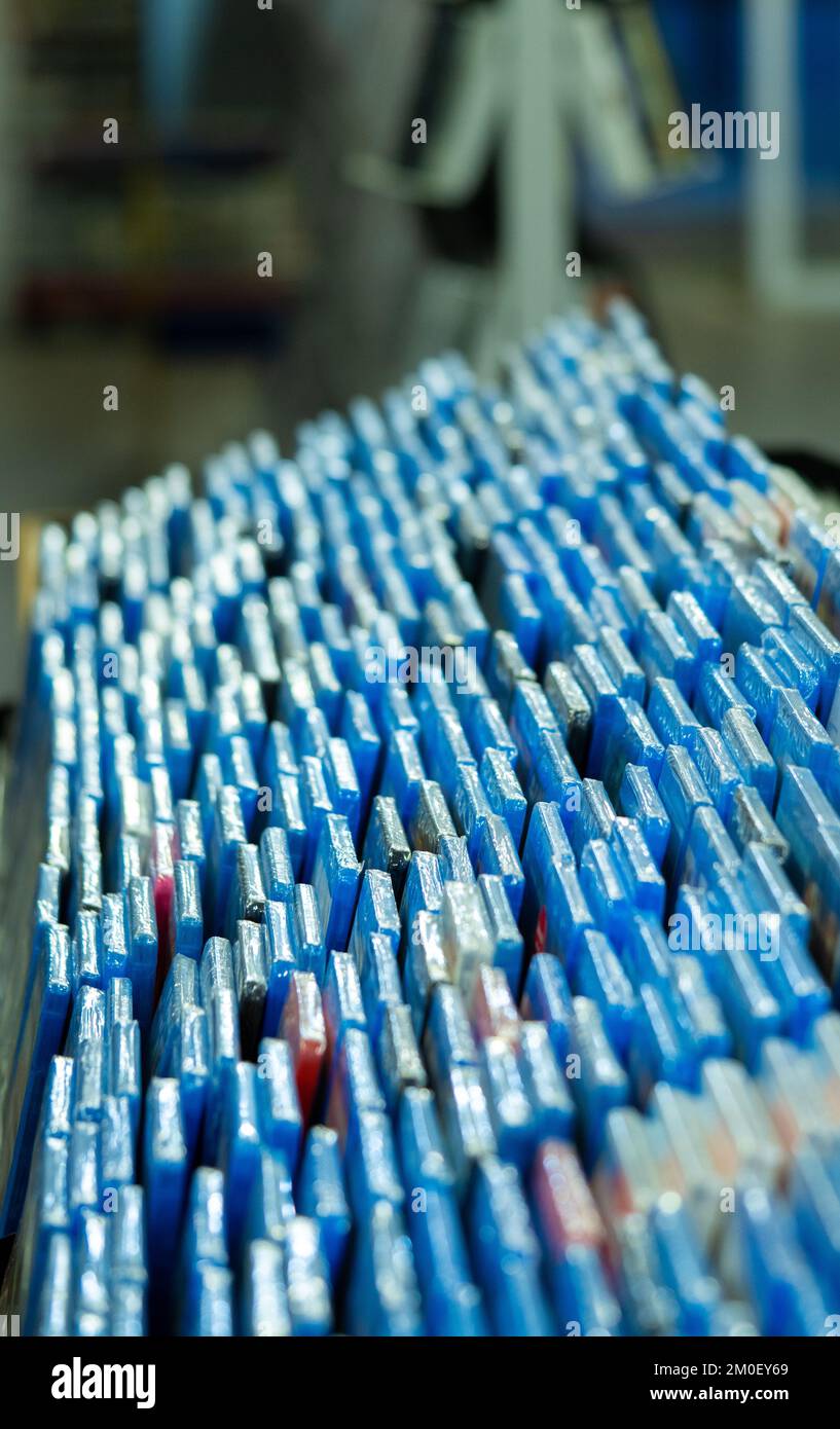 Detail of movies and dvds on a shelf in a movie collectors shop and ...