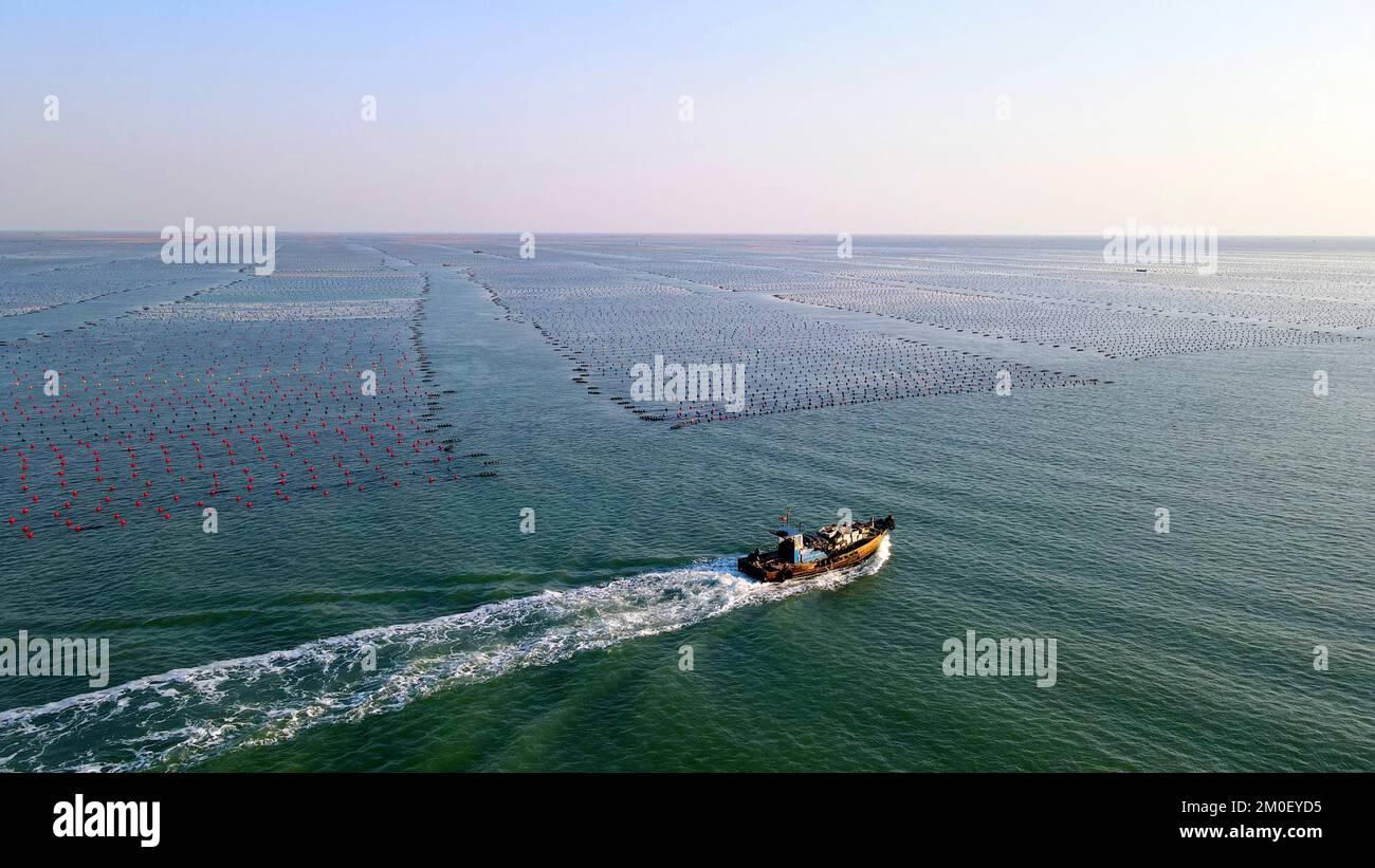 Aerial photos show fishermen engaged in marine production at the marine ...