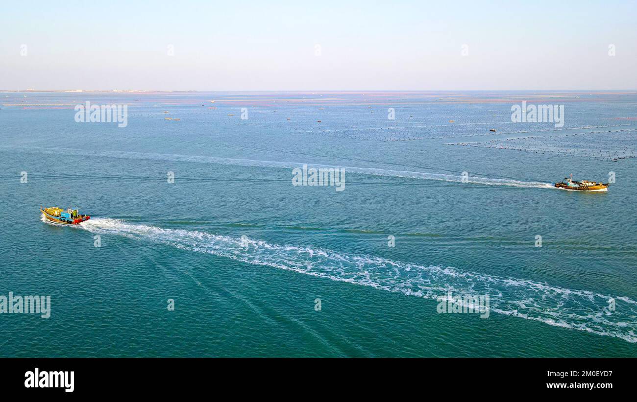 Aerial photos show fishermen engaged in marine production at the marine ...