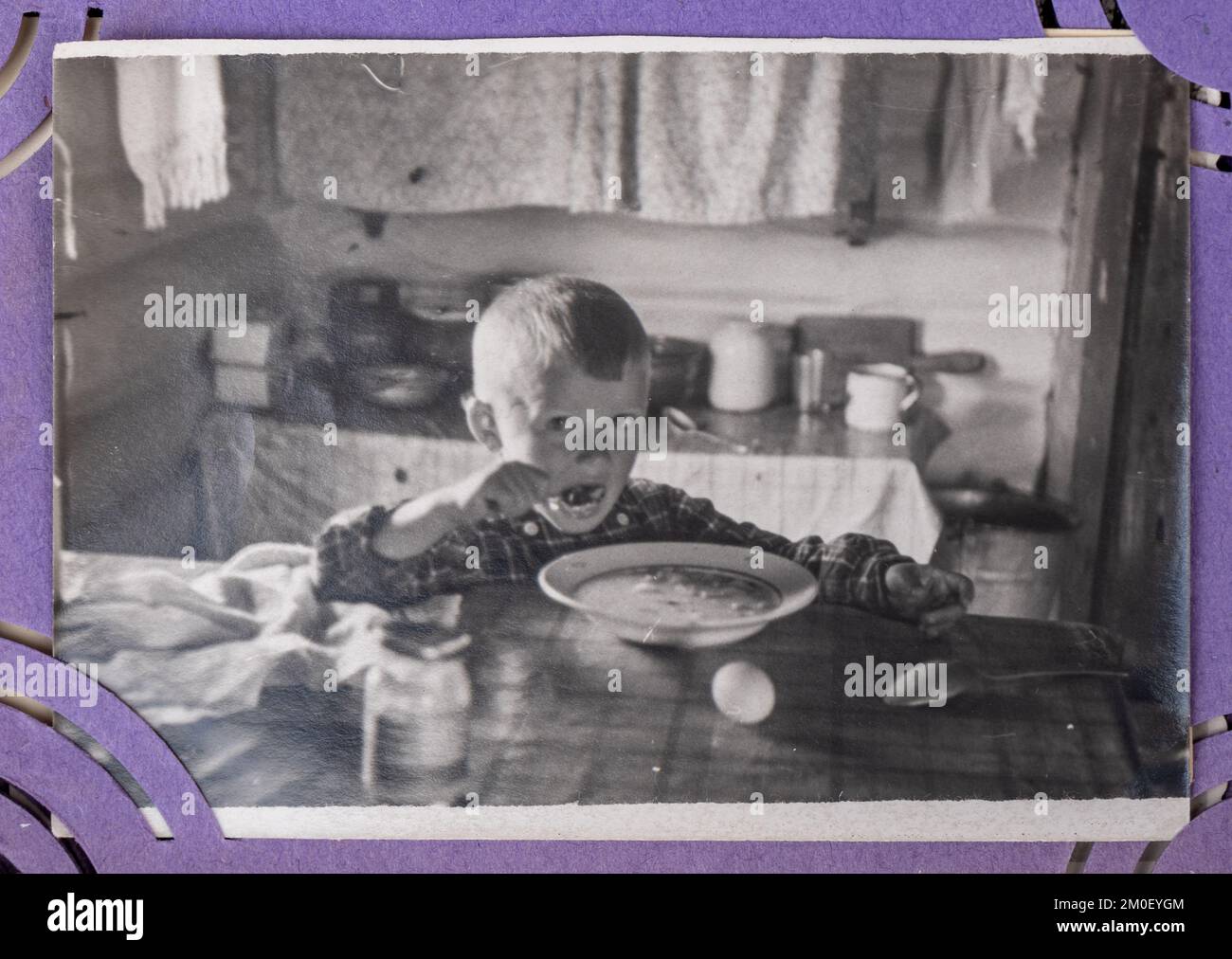 USSR - circa 1960s: a little boy eats soup from a big bowl. Concept old ...