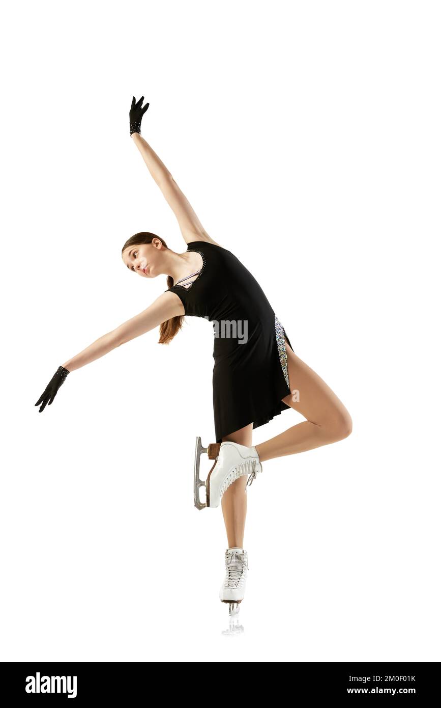 Young teen girl, junior female figure skater in black stage costume ...