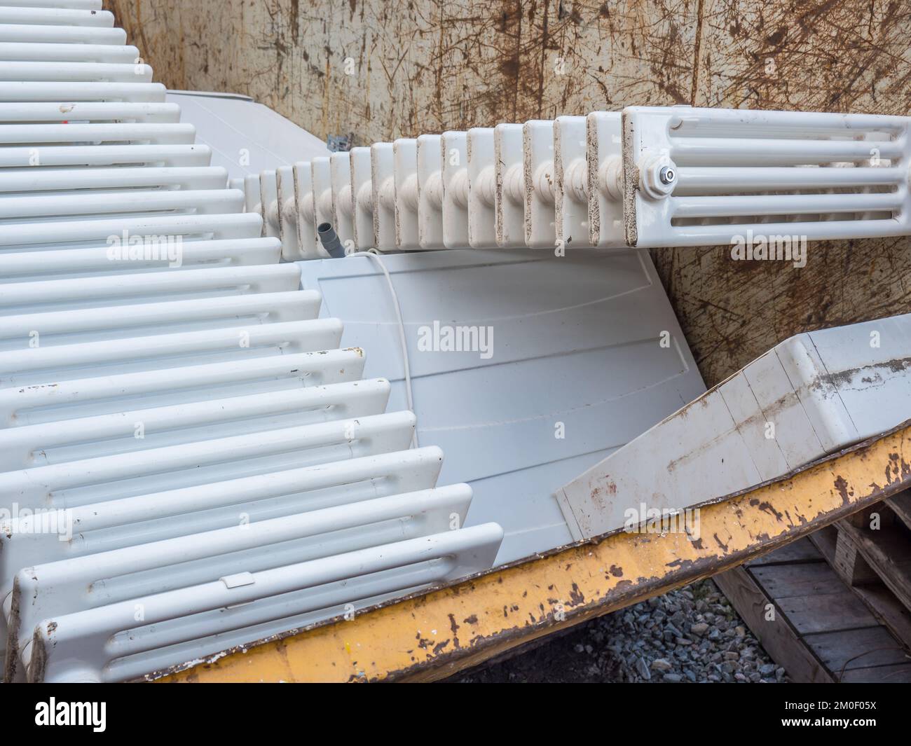 Container with old radiators for recycling Stock Photo - Alamy
