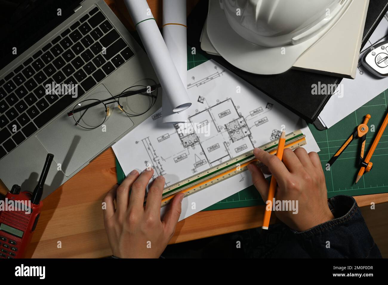 Engineer or architect man working with blueprints, planning development ...