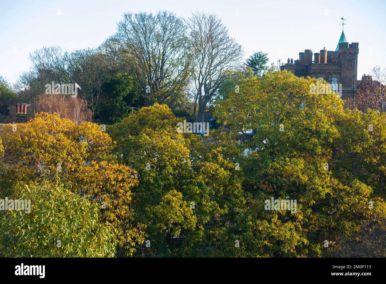 The Old Royal Observatory visible over the early autumn trees of ...