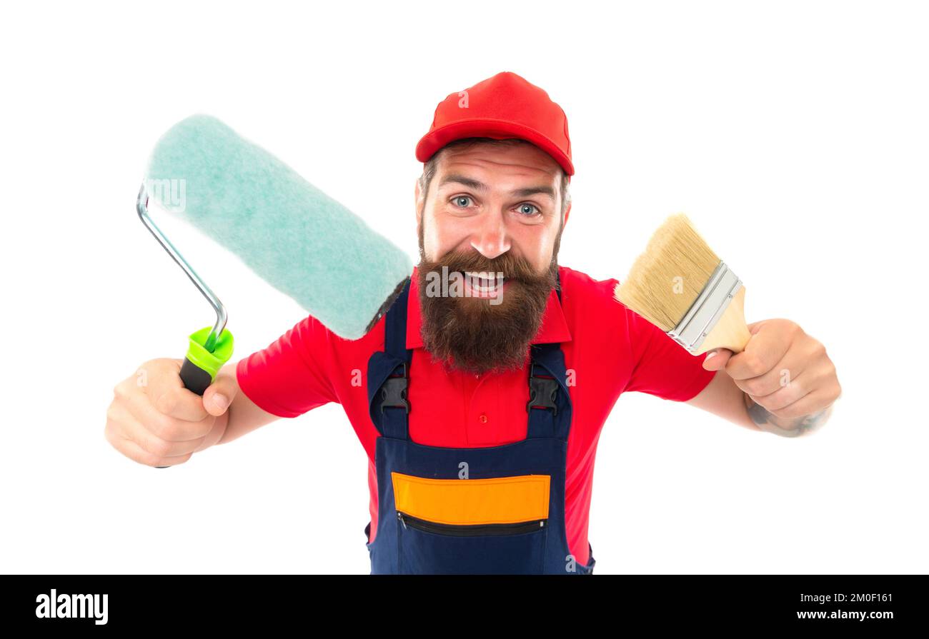 happy decorator with paintroller and paint brush. decorator with ...