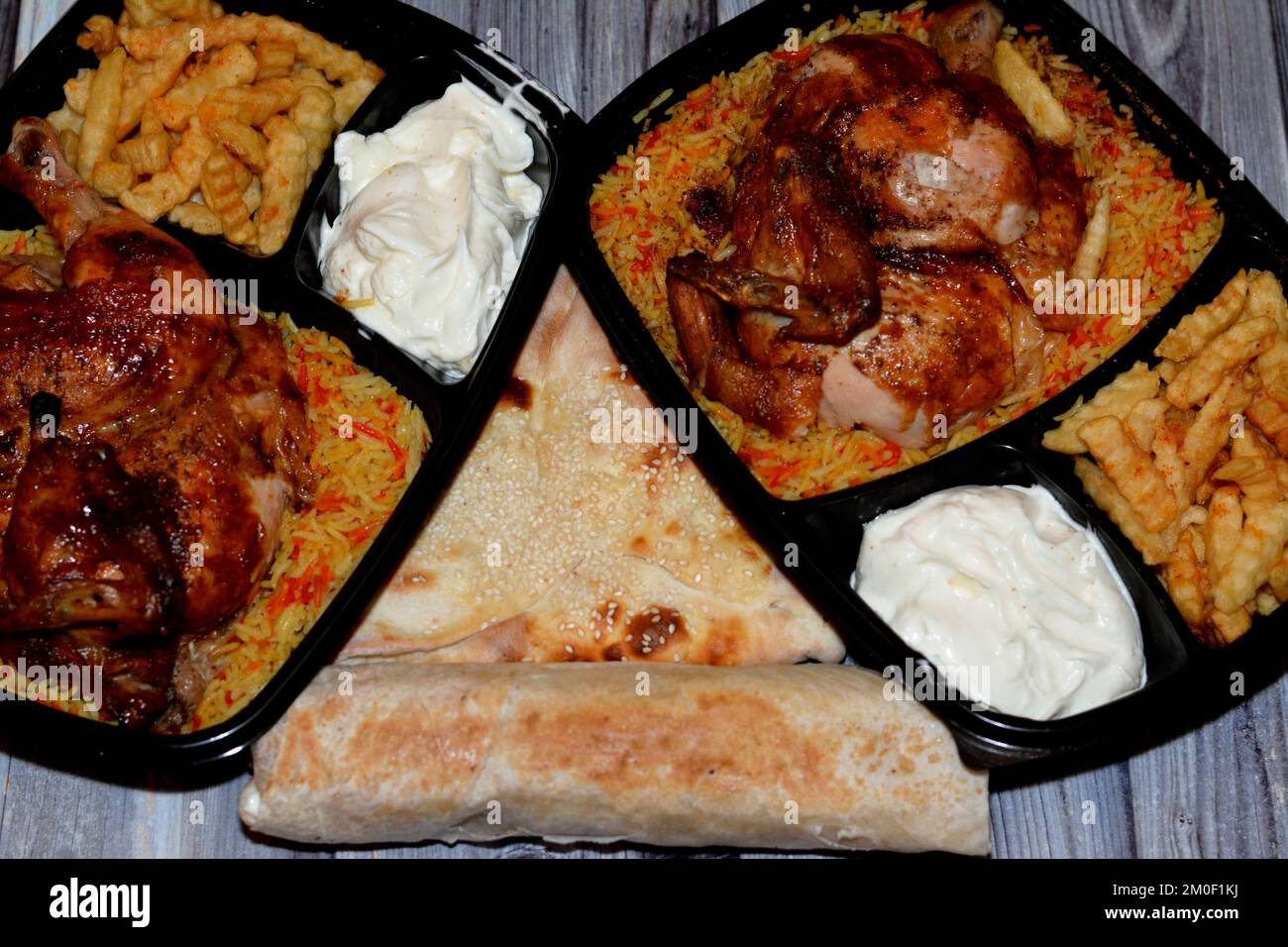 Syrian cuisine of chicken shawerma or shawarma wrapped, baked Manakish ...