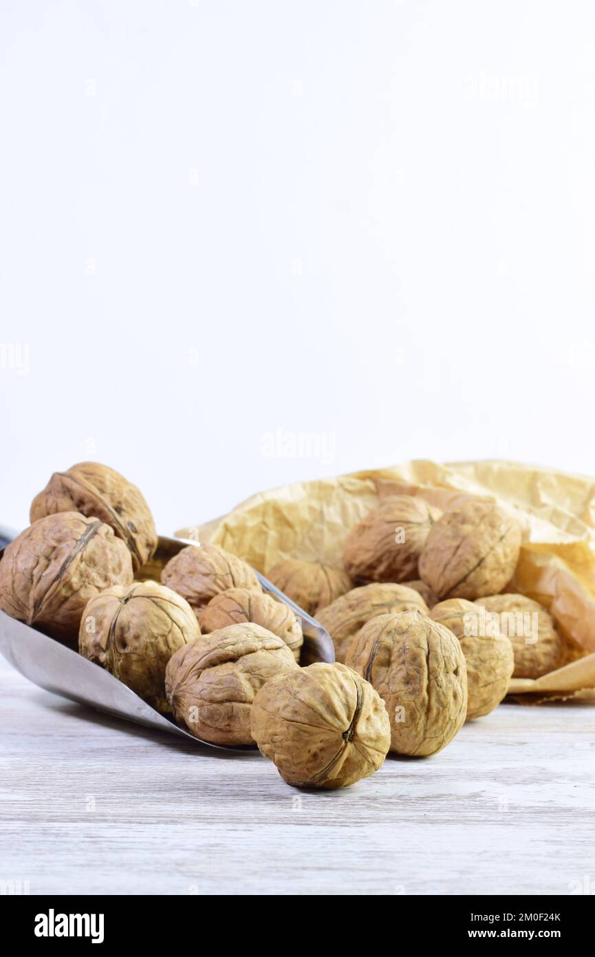 A closeup shot of very healthy walnut on a wooden table Stock Photo - Alamy