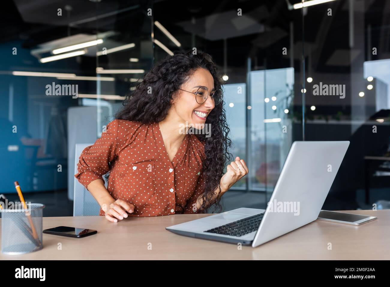 Hispanic business woman celebrating victory success, employee with ...