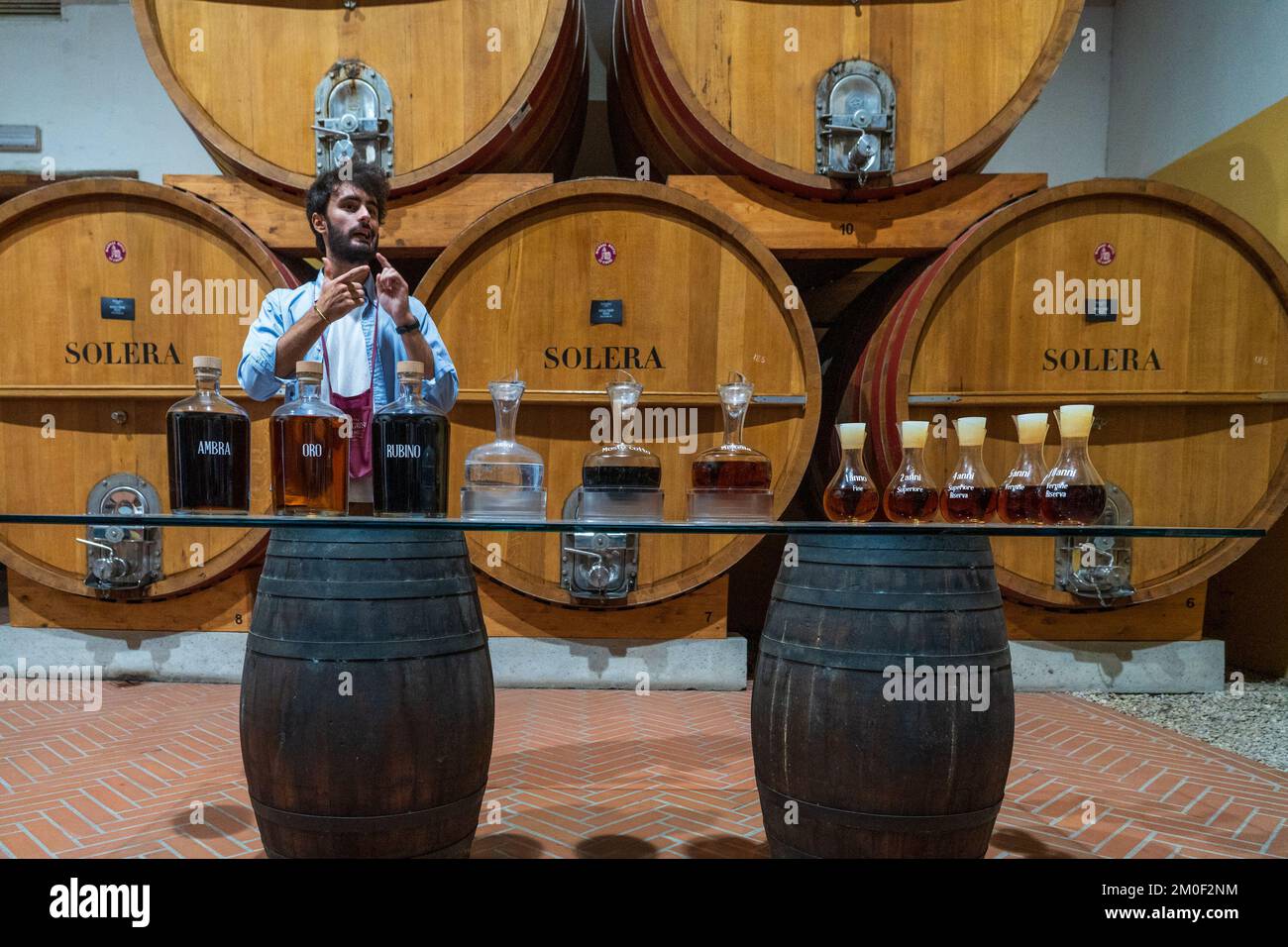 Wine tour inside the celar of Cantine Pellegrino containing oak barrels ...