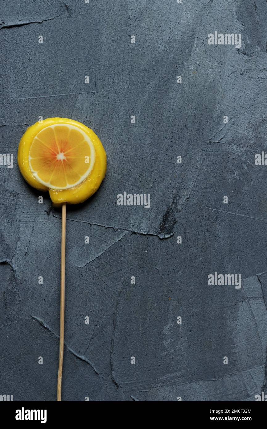 Lollipop candy on a grey background Stock Photo - Alamy
