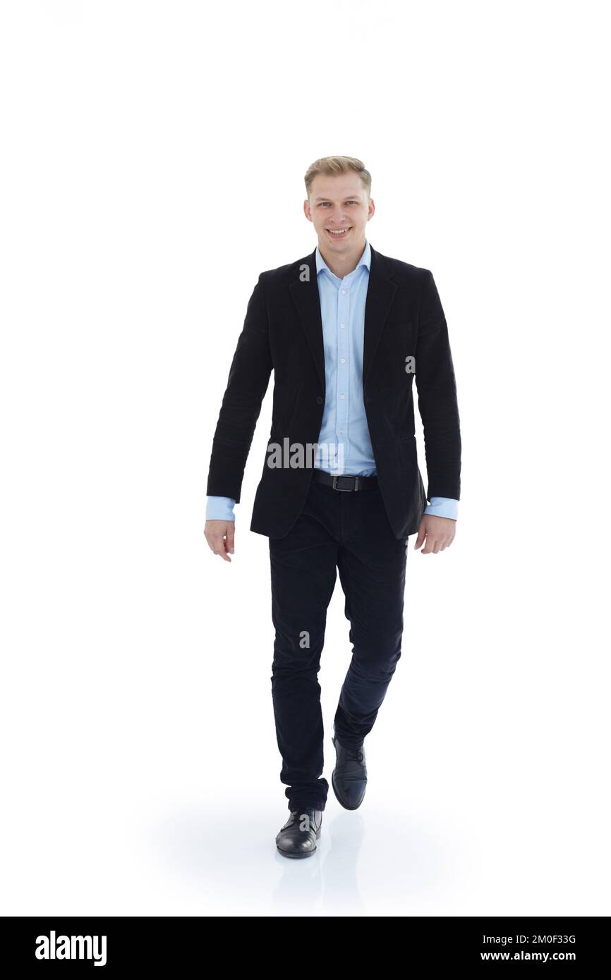 in full growth.a young man in a business suit striding forward Stock ...