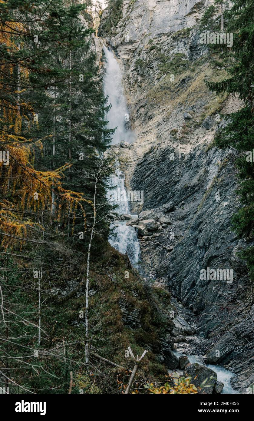 Beautiful waterfall in moody forest in autumn in Gozd Martuljek in ...