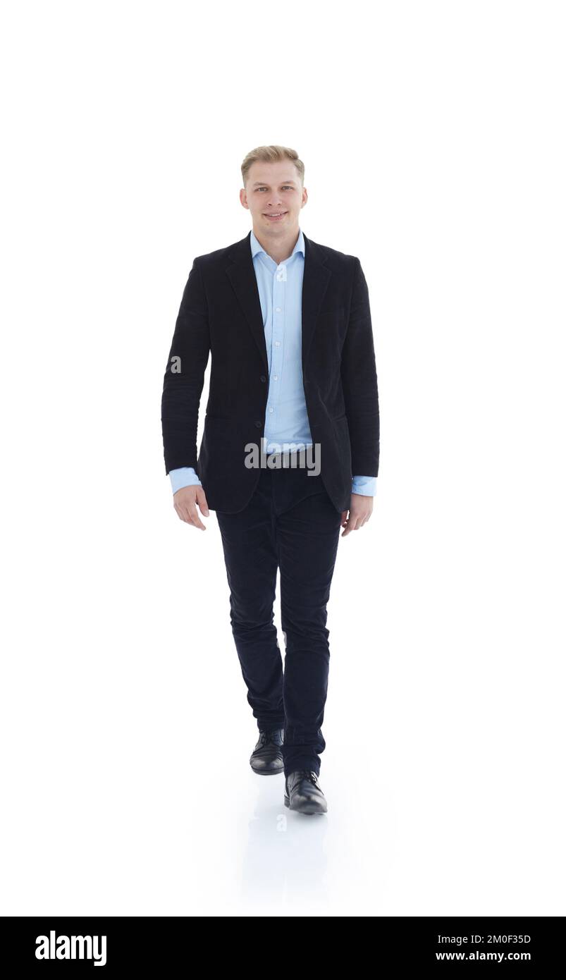 in full growth.a young man in a business suit striding forward Stock ...