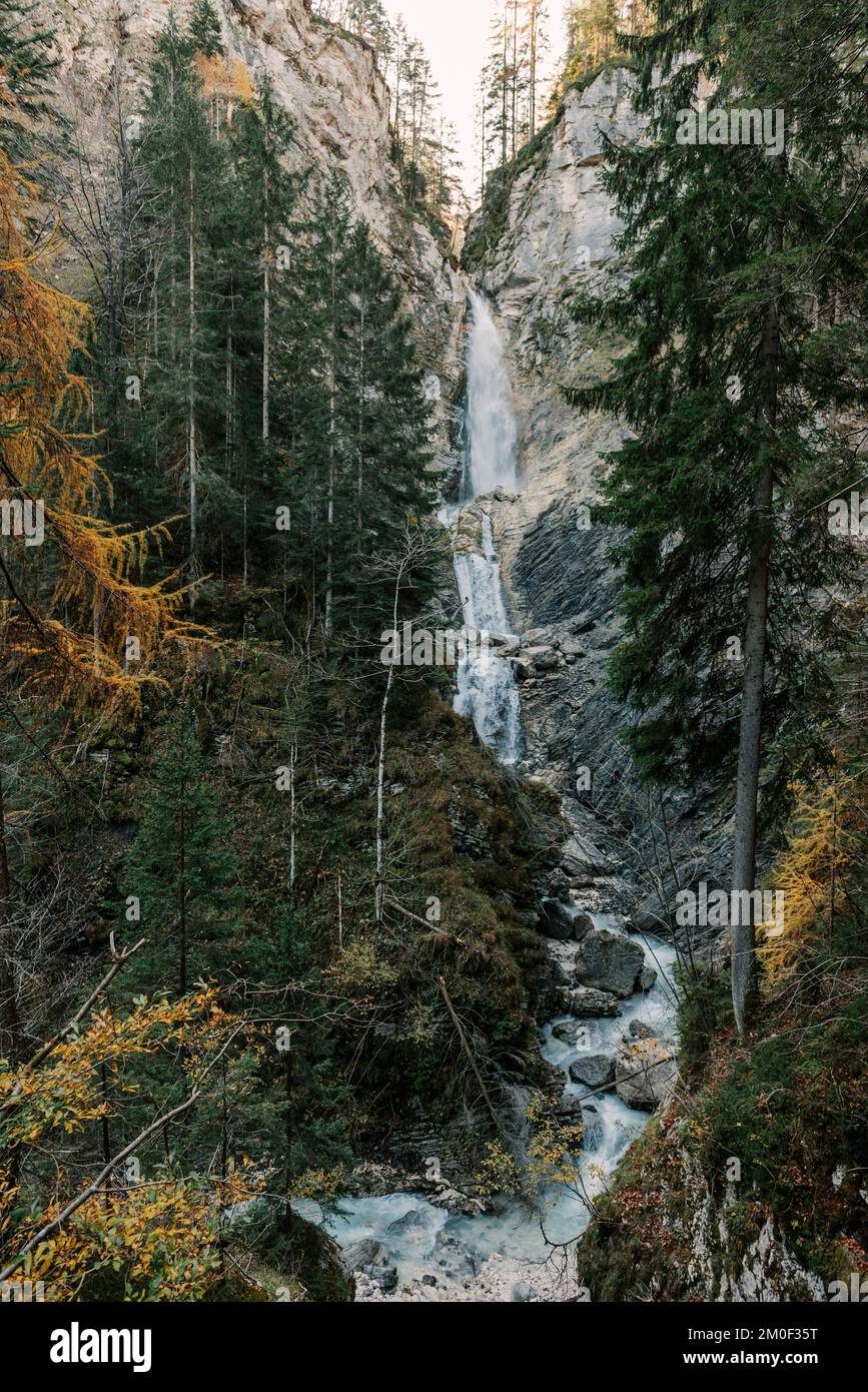 Beautiful waterfall in moody forest in autumn in Gozd Martuljek in ...