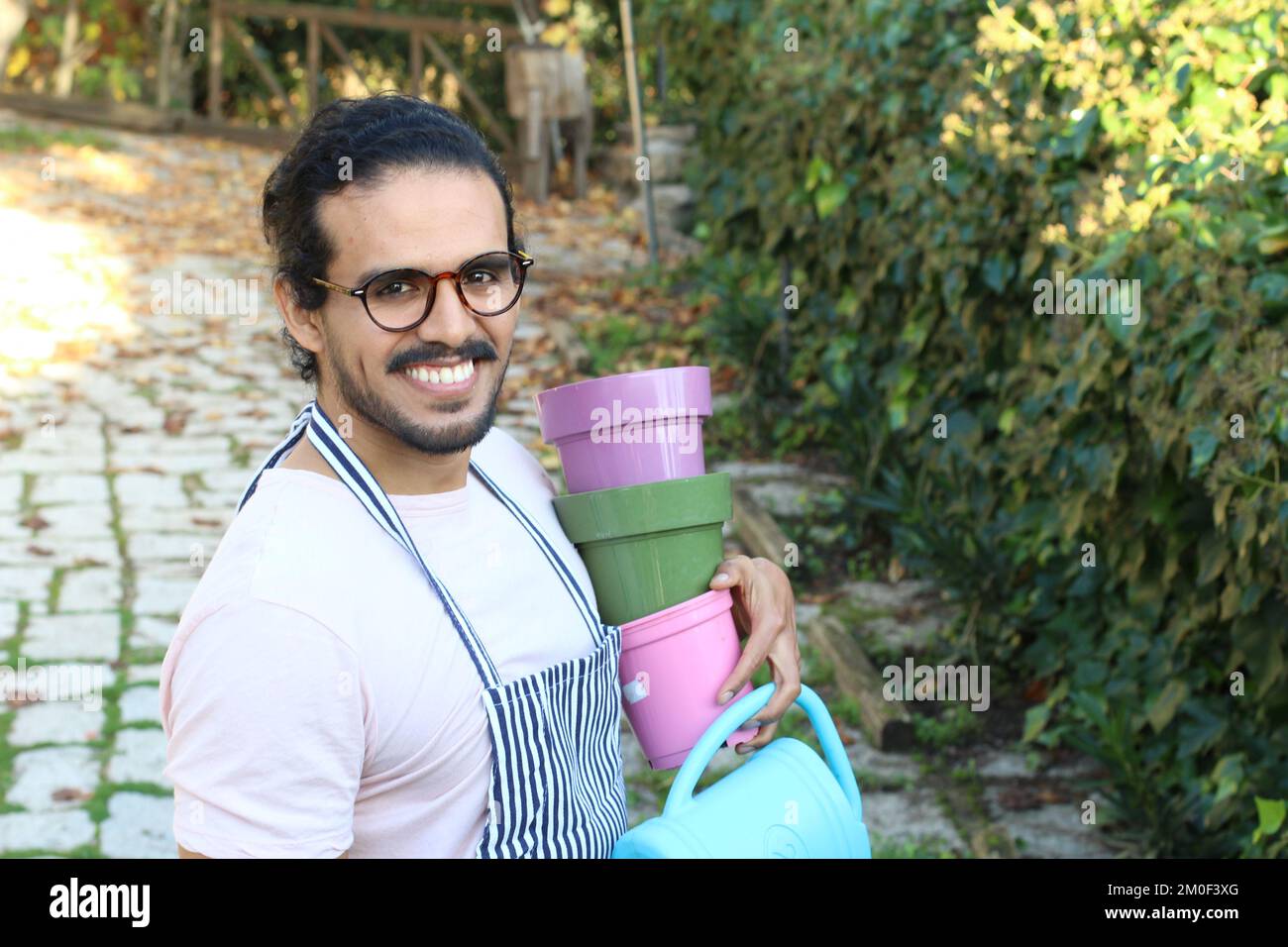 Young male gardener holding hi-res stock photography and images - Alamy
