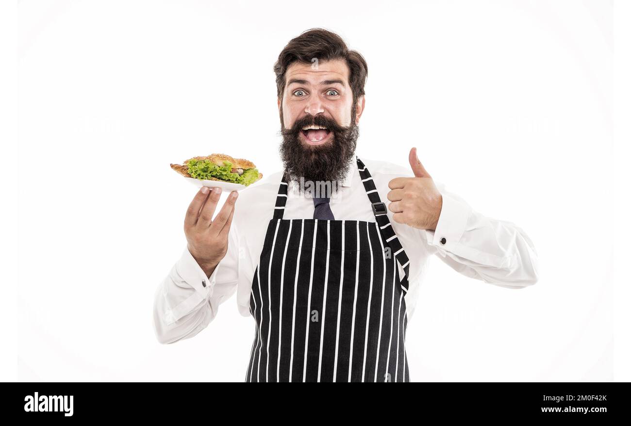 Junk food. Delicious croissant. Man bearded waiter wear apron carry ...