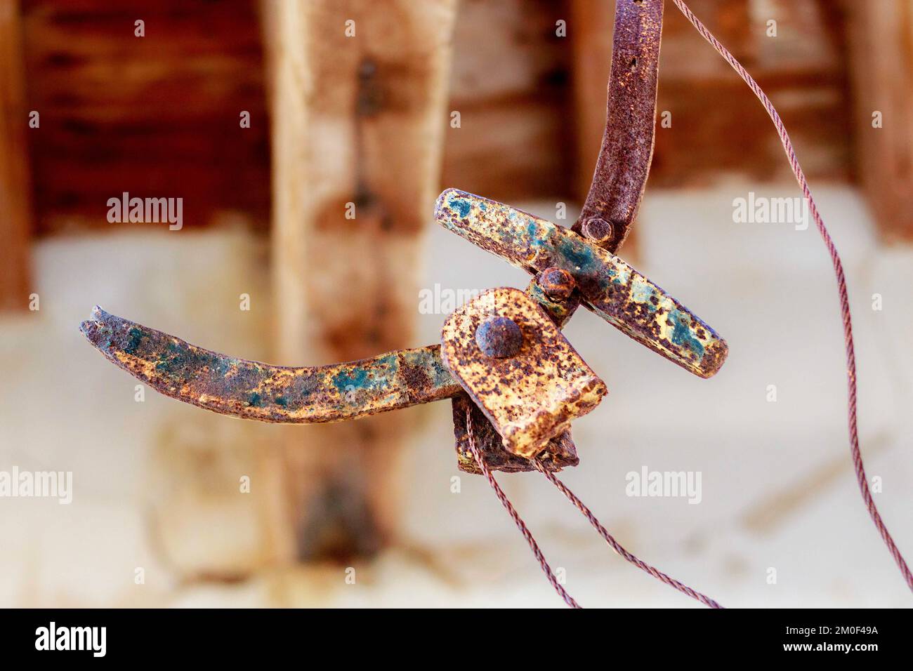 Weathered and rusty hook of a scale in an abandoned mine building ...
