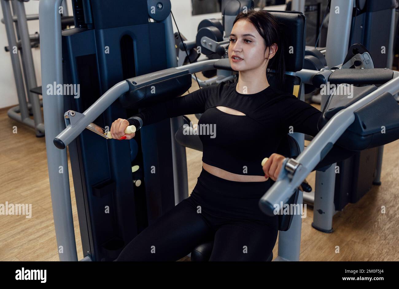 Bodybuilder woman training on simulator hi-res stock photography and ...