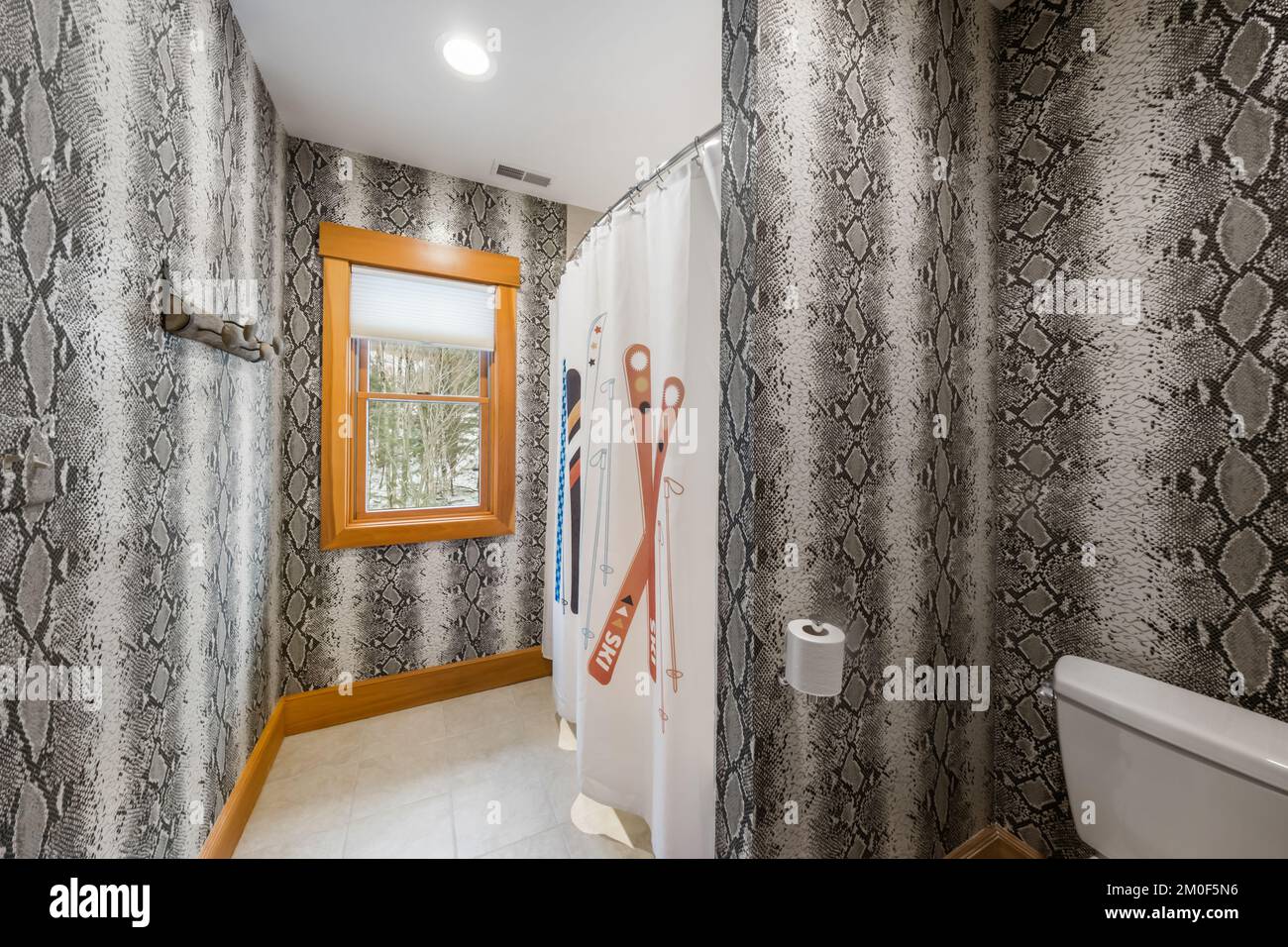 A modern bathroom interior design with a snake skin pattern. Custom ...