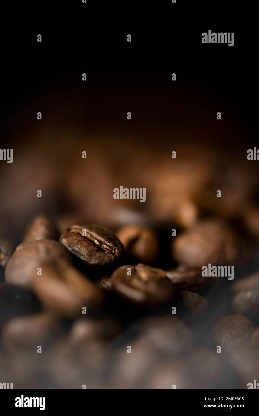 A 4K of coffee beans on blurred background Stock Photo - Alamy