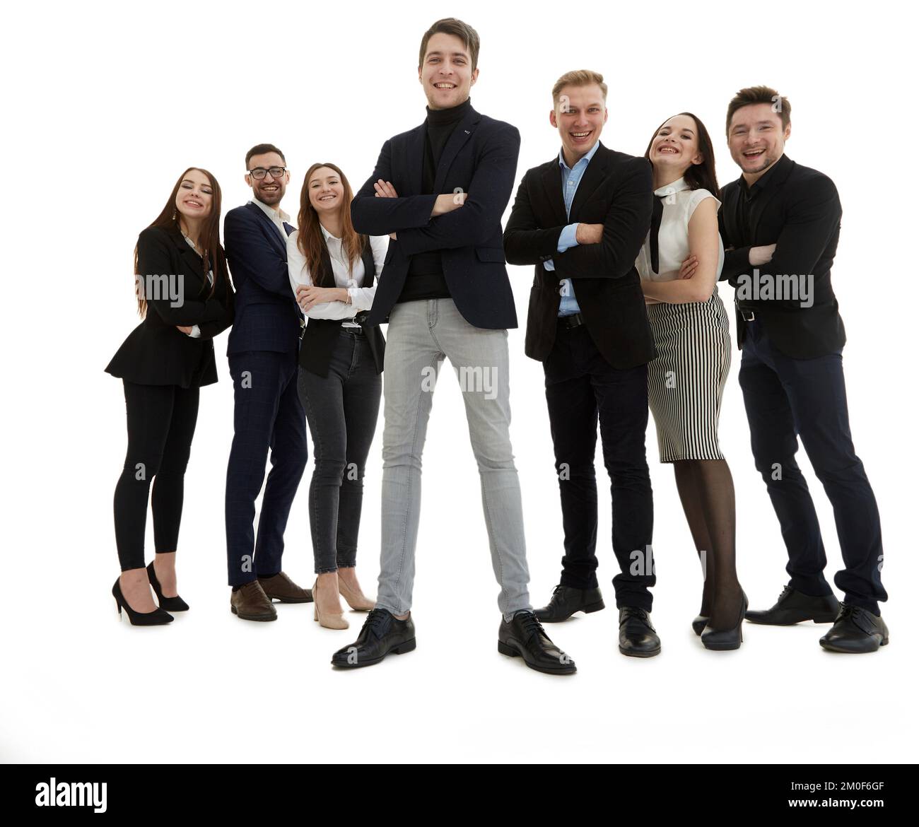 team of fun young business people standing together Stock Photo - Alamy