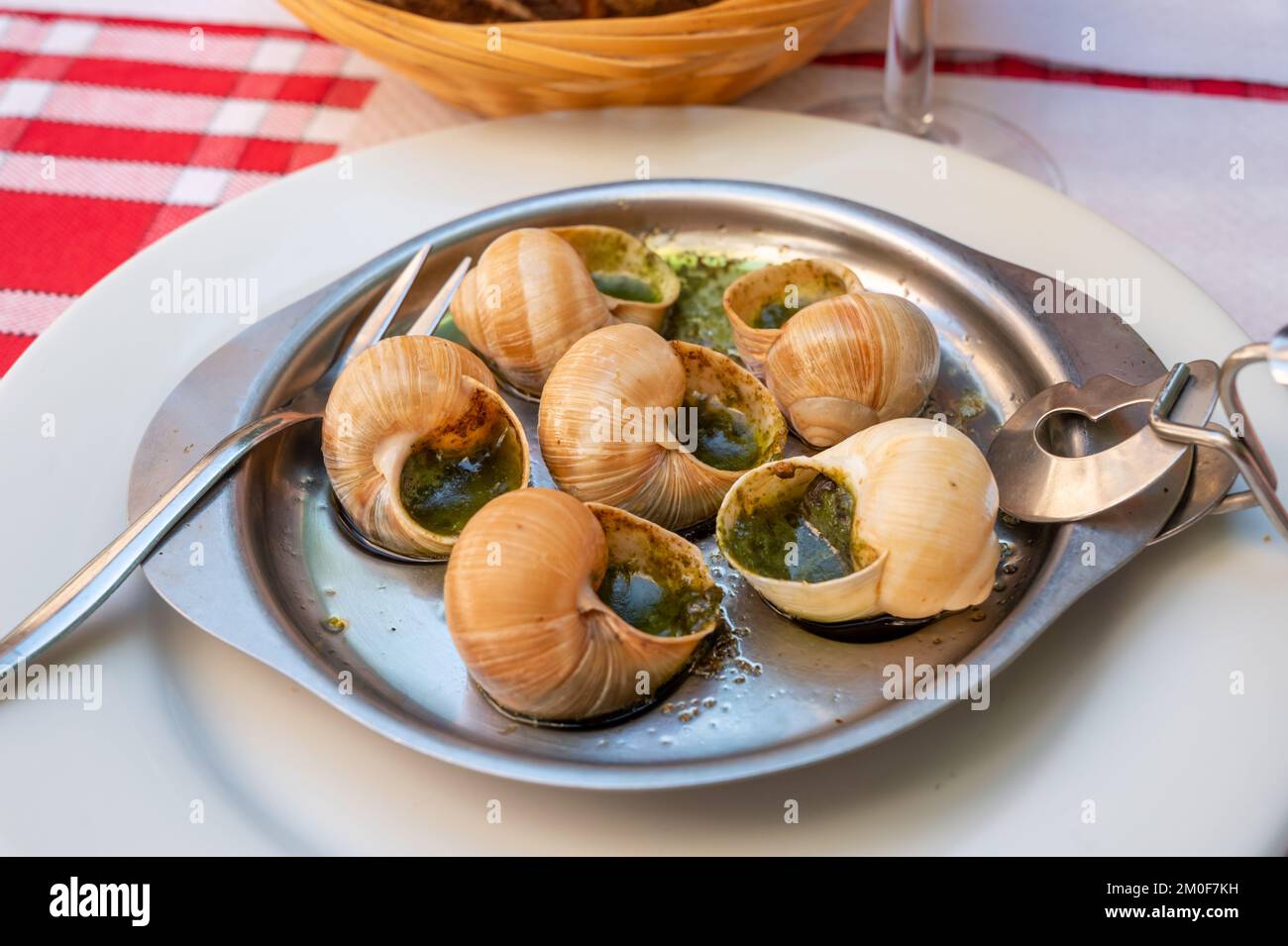 Starter dish in traditional restaurants on Burgundy, snails cooked with ...