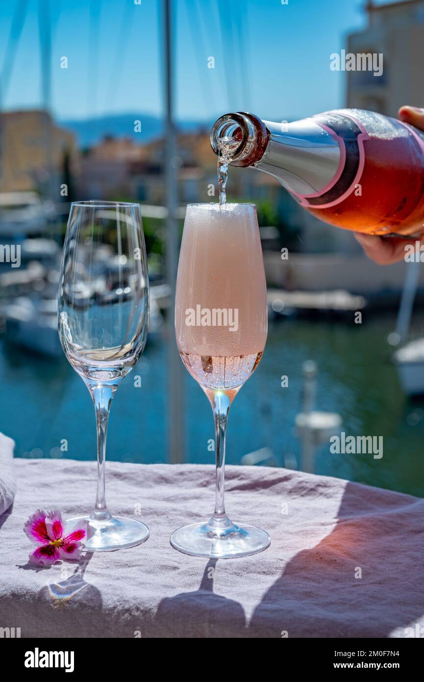 New year party, drinking of French brut rose champagne sparkling wine ...