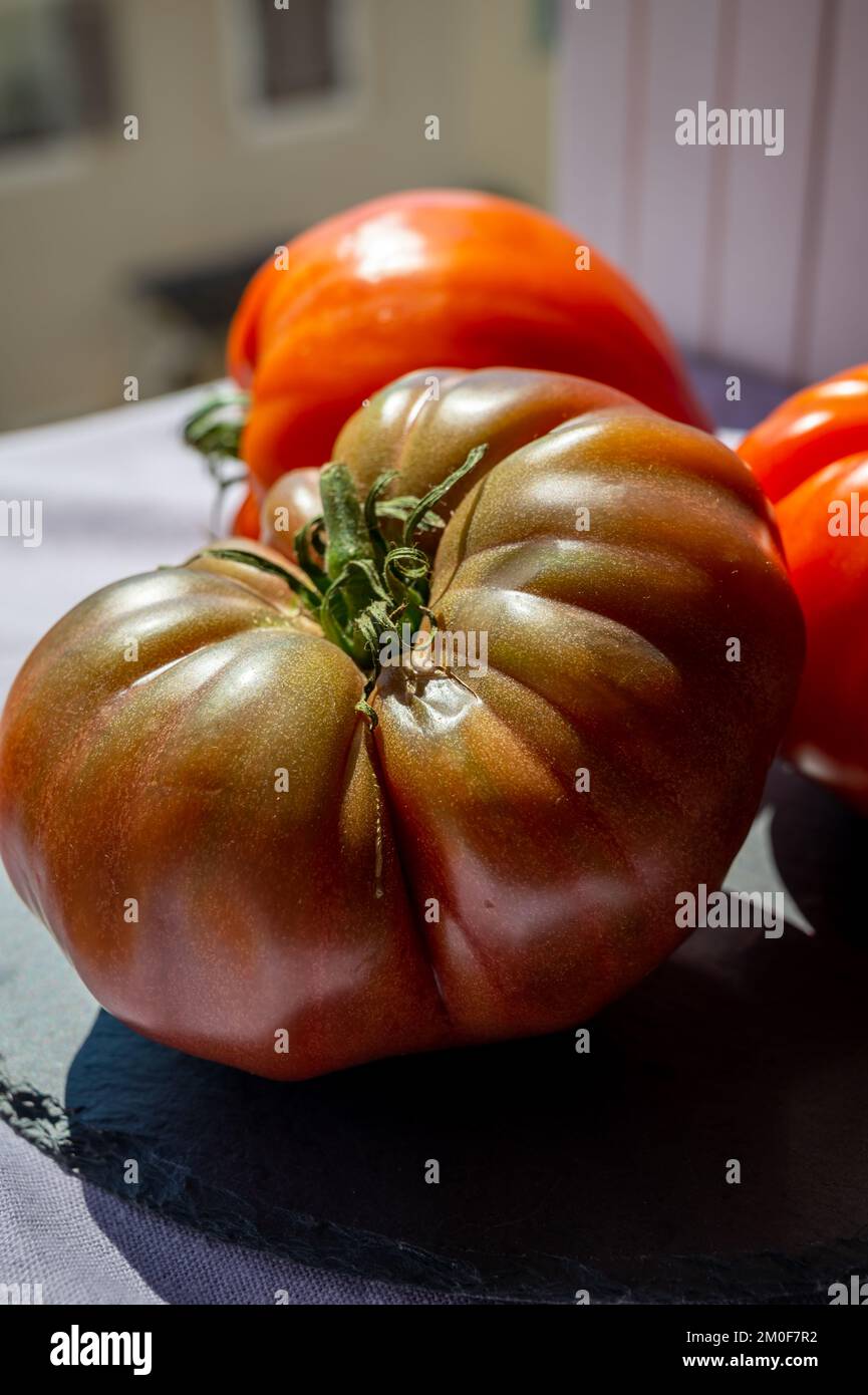 Fresh ripe colorful french tomatoes vegetables from Provence in wooden ...