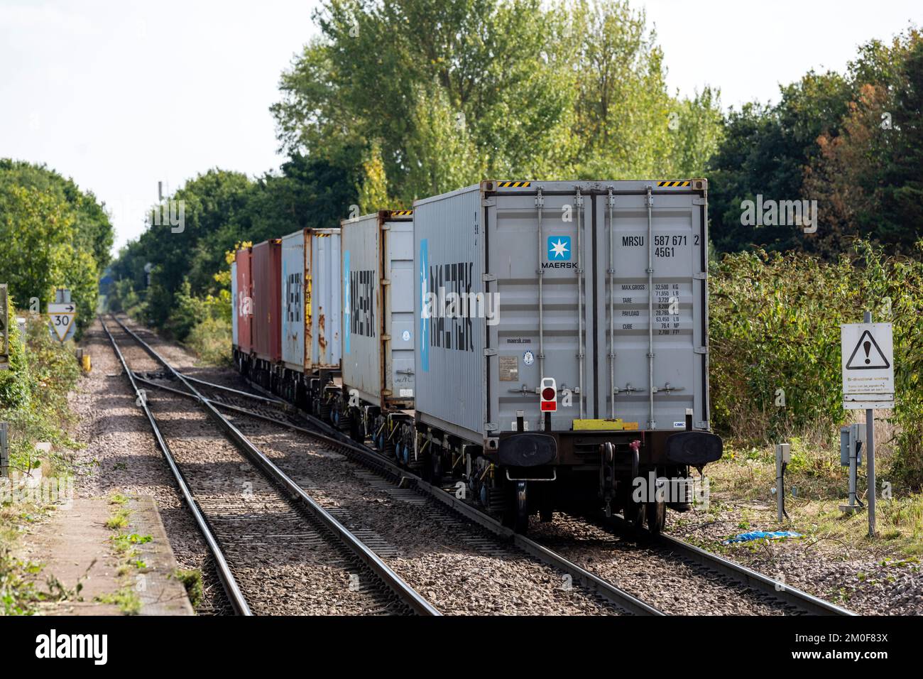 Freight train heading towards the port of Felixstowe Trimley Suffolk UK ...
