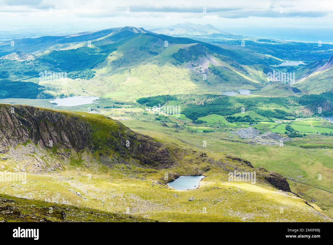 Climbing up mount Snowdon in North Wales. View of the hills and ...
