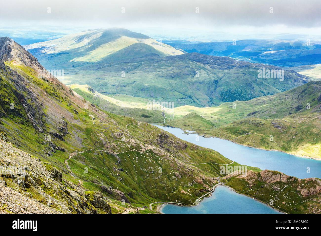 Climbing up mount Snowdon in North Wales. View of the hills and ...