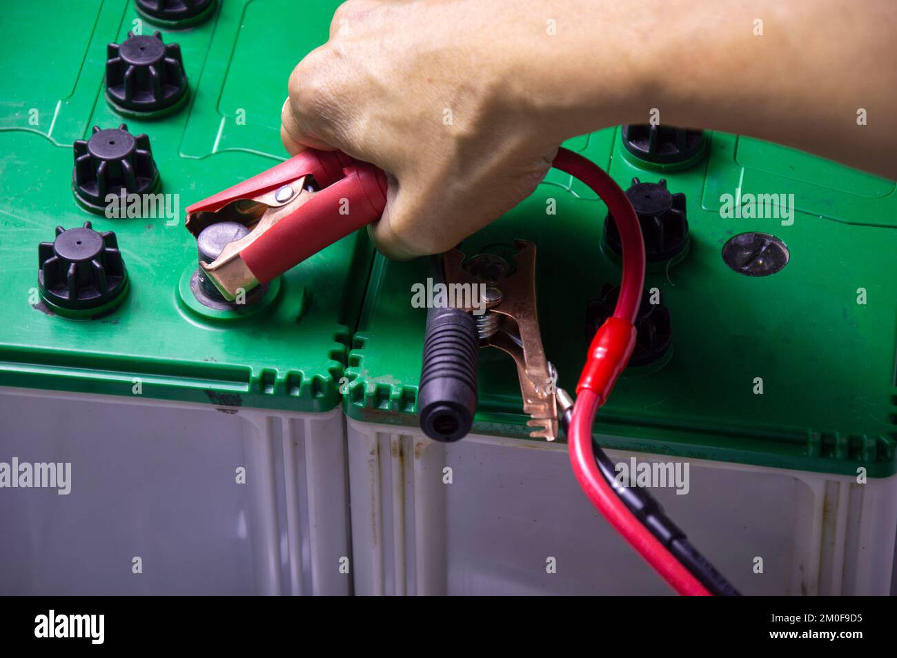 Top view, mechanic working with battery tweezers Stock Photo - Alamy