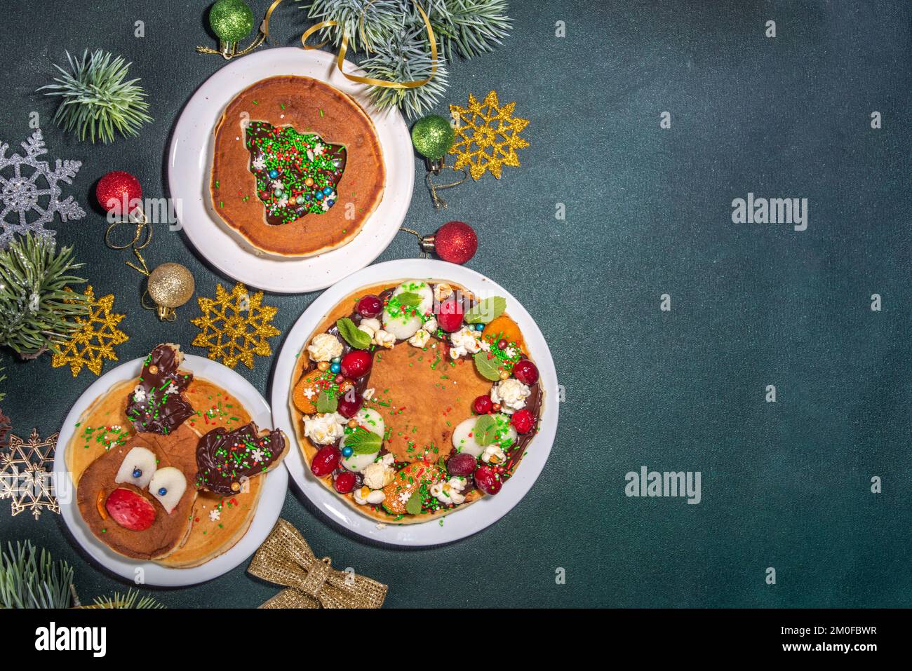 Funny pancakes in shapes of deer, Christmas tree, Christmas wreath made ...