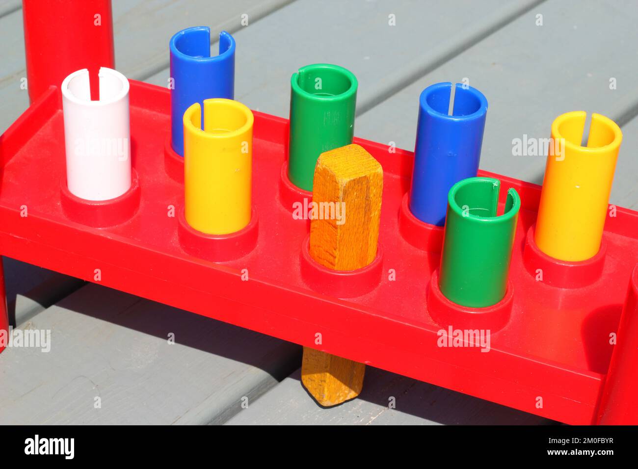 Square peg in a round hole concept. Doesn't fit. Wrong place Stock ...