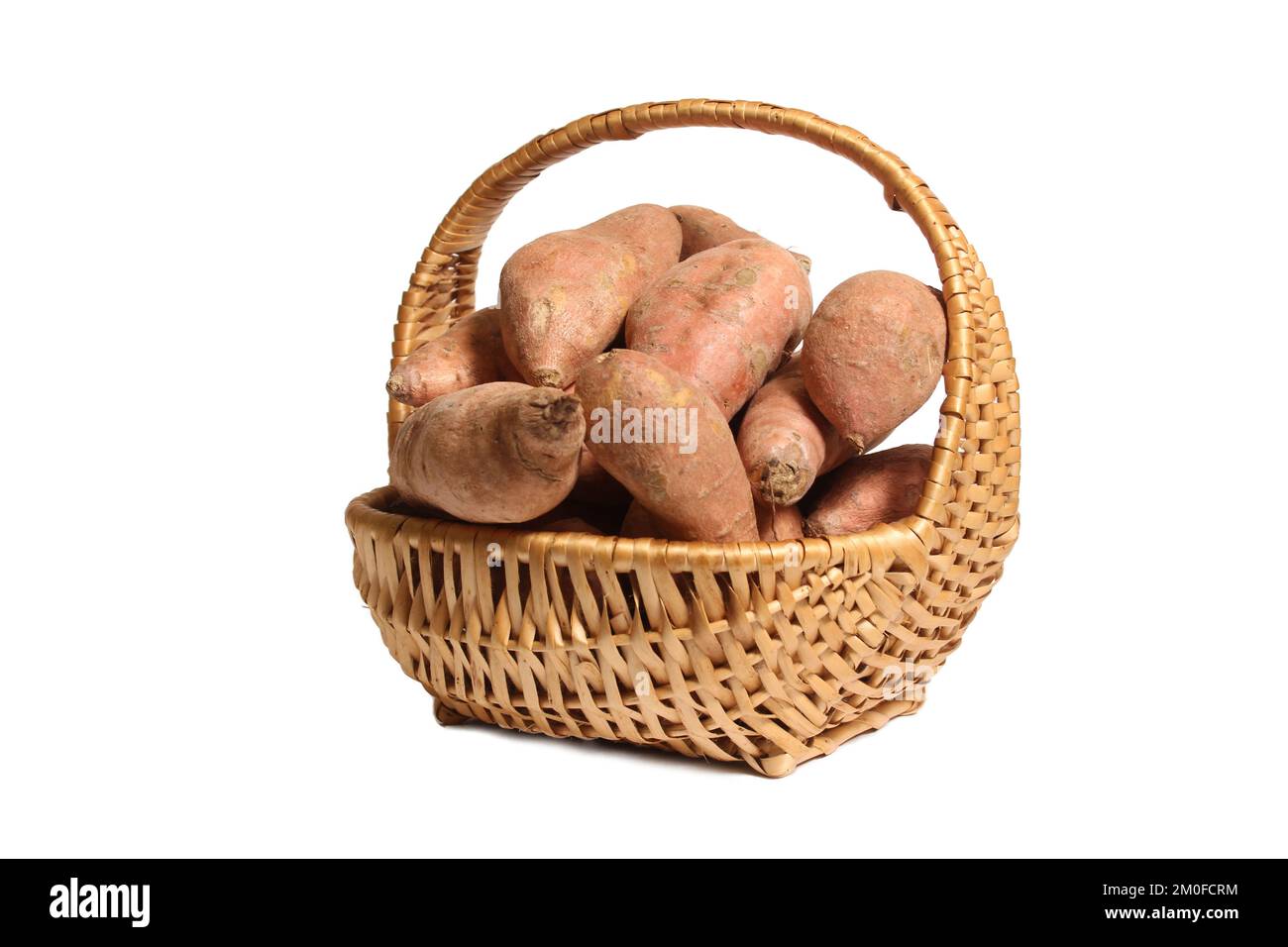Wicker Basket of Sweet Potatoes Isolated on White Background Stock ...