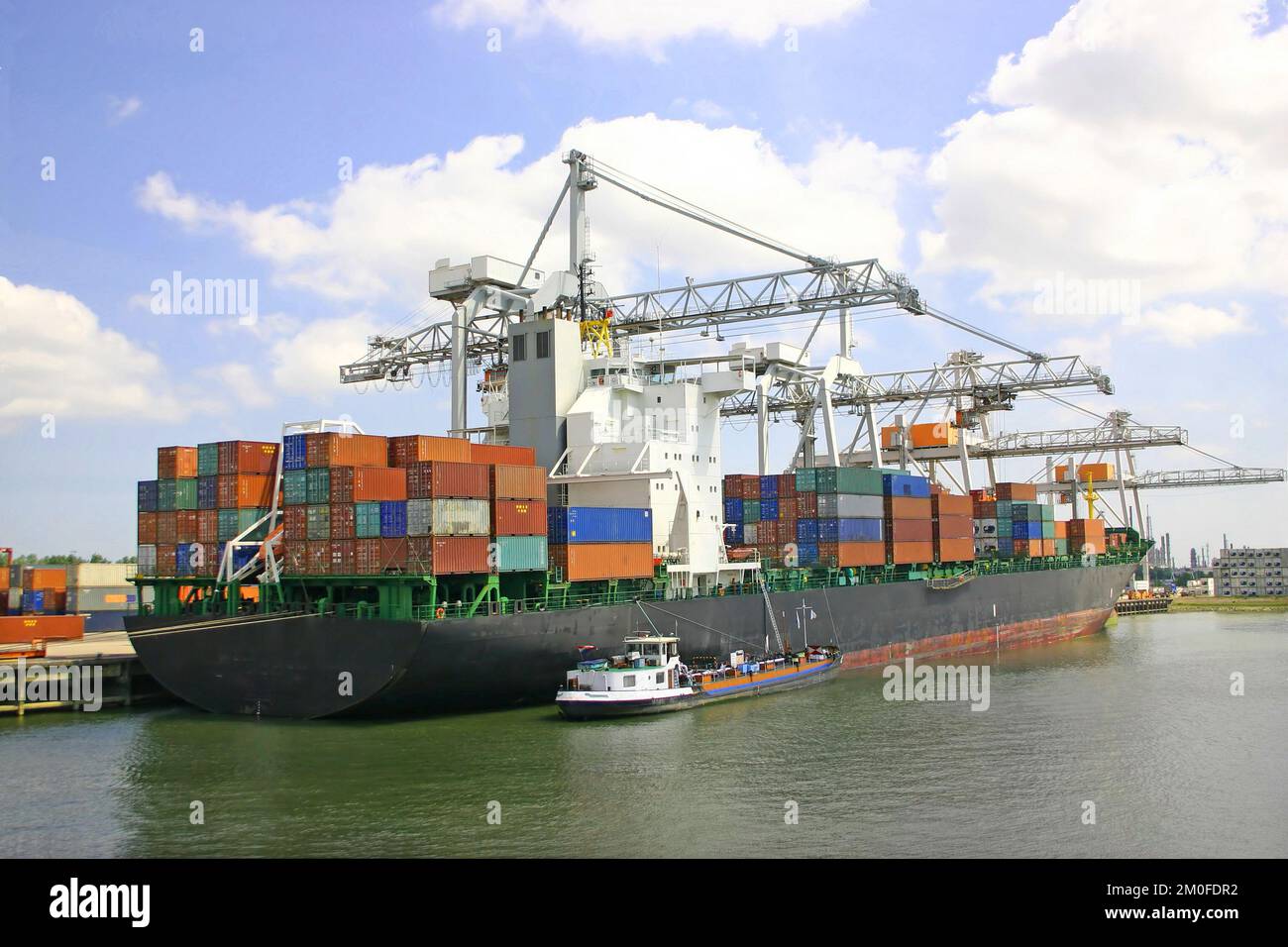 Loaded container ship at sea example Stock Photo - Alamy