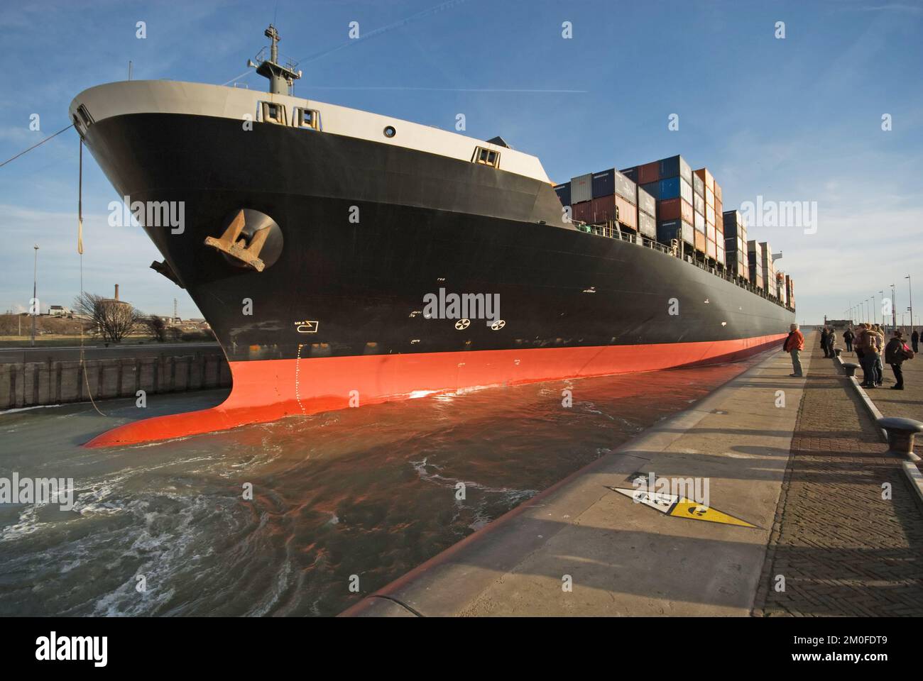 Big cargo vessel in dock Stock Photo - Alamy