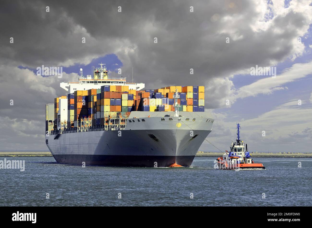Loaded container ship at sea example Stock Photo - Alamy