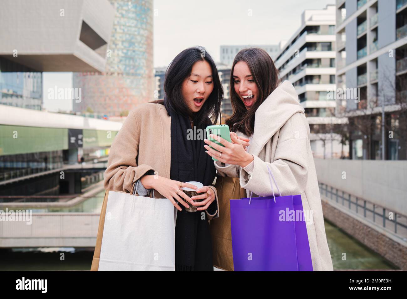 Two multiethnic women using hi-res stock photography and images - Alamy