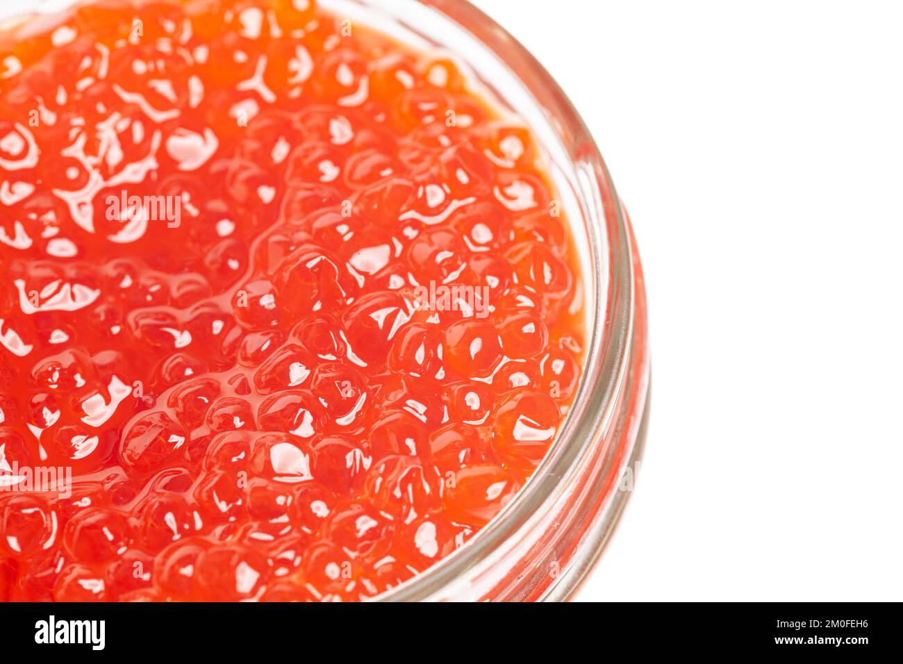 Glass jar with delicious red caviar isolated on white background Stock ...