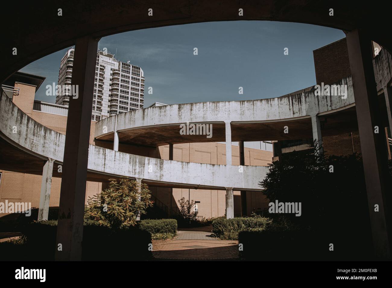 A spiral concrete car park ramp and building on background in Swindon ...