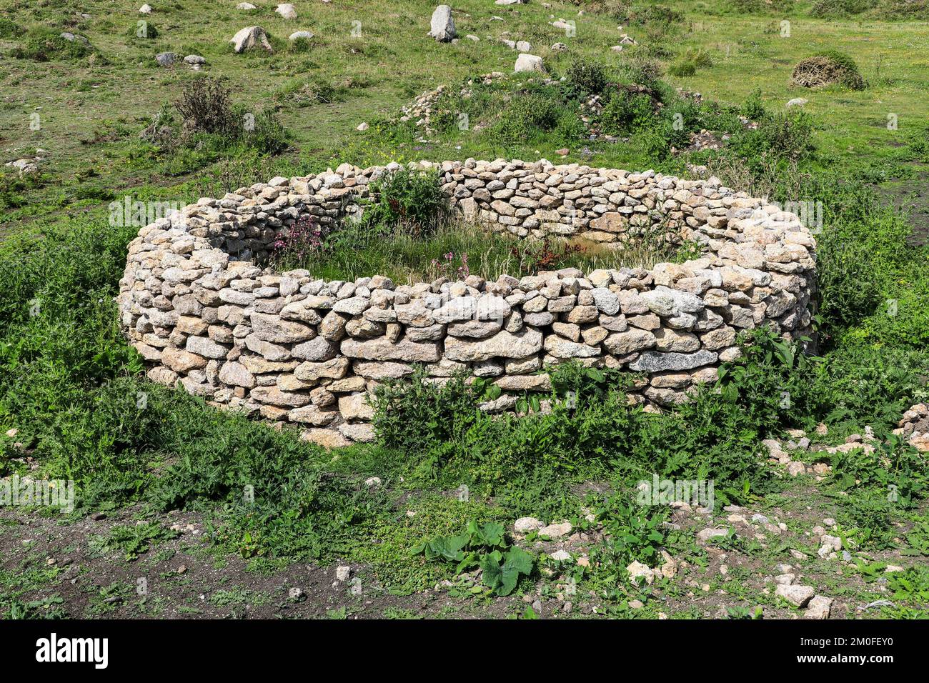 A granite dry stone wall built around an old mine shaft for safety ...