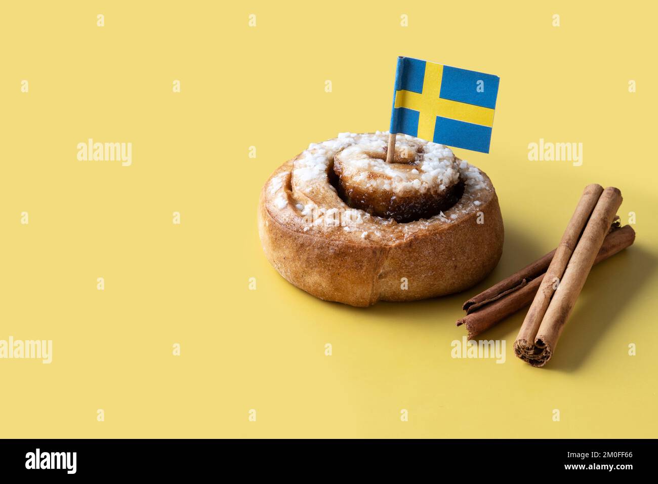 Cinnamon rolls buns on yellow background. Kanelbulle Swedish dessert ...