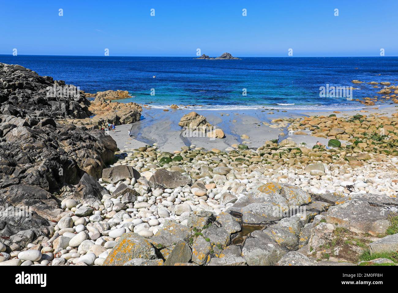 The sea and the cliff rocks, with The Brisons in the distance, at Cot ...