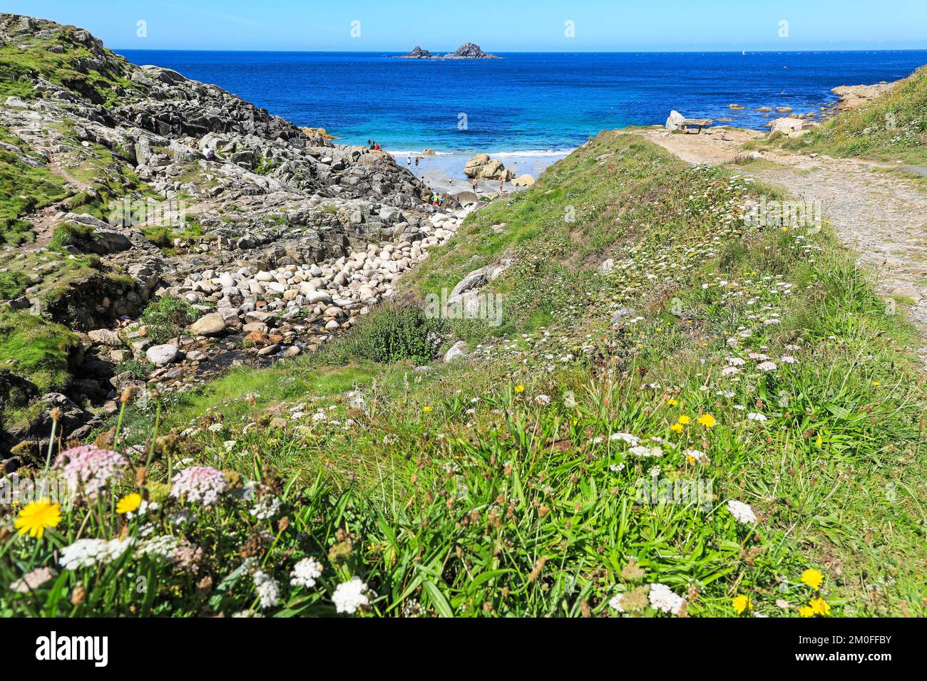 The sea and the cliff rocks, with The Brisons in the distance, at Cot ...