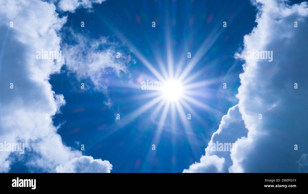 Aerial view of beautiful sky with clouds and sun on a summer day. Time ...