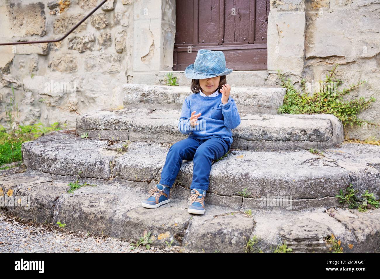 Little boy on stairs hi-res stock photography and images - Alamy