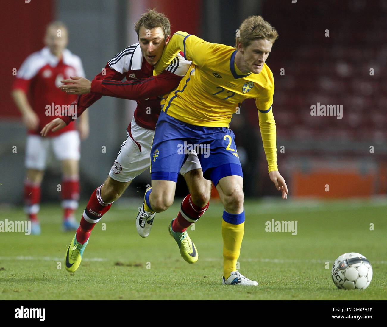 Denmark's Christian Eriksen (left) and Sweden's Rasmus Elm (right ...
