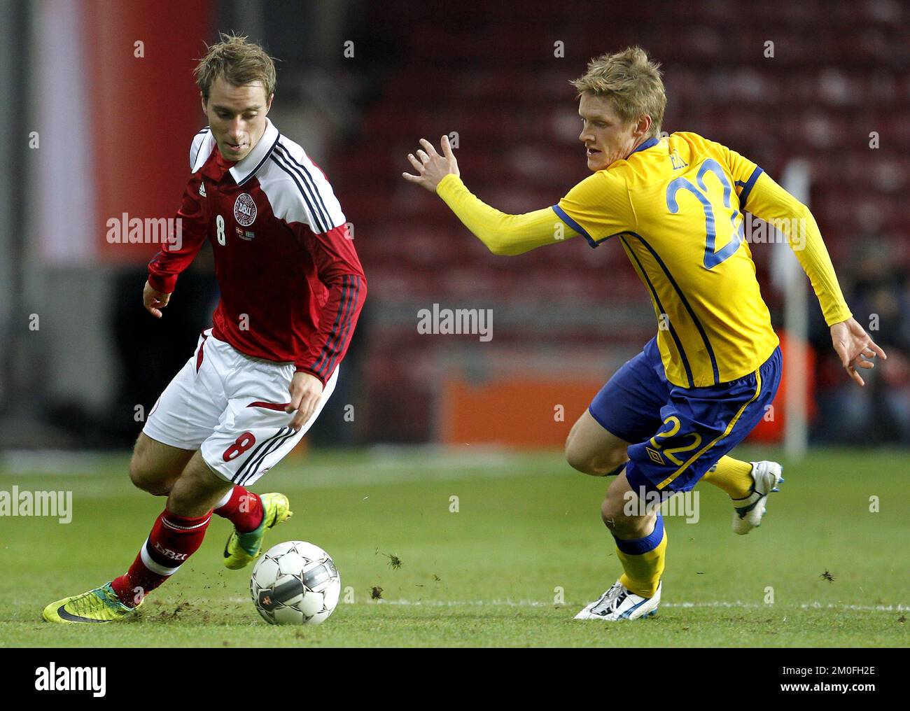 Denmark's Christian Eriksen (left) and Sweden's Rasmus Elm (right ...